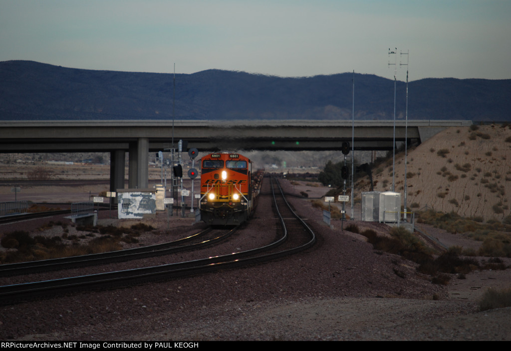 BNSF 6801 knocks down the west Barstow Yard Main Line Signals as she rolls west on Main 1.